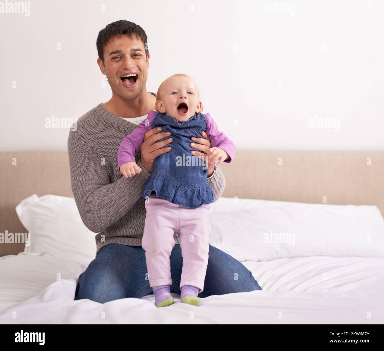 Theyre having so much fun together. A young father playing with his ...