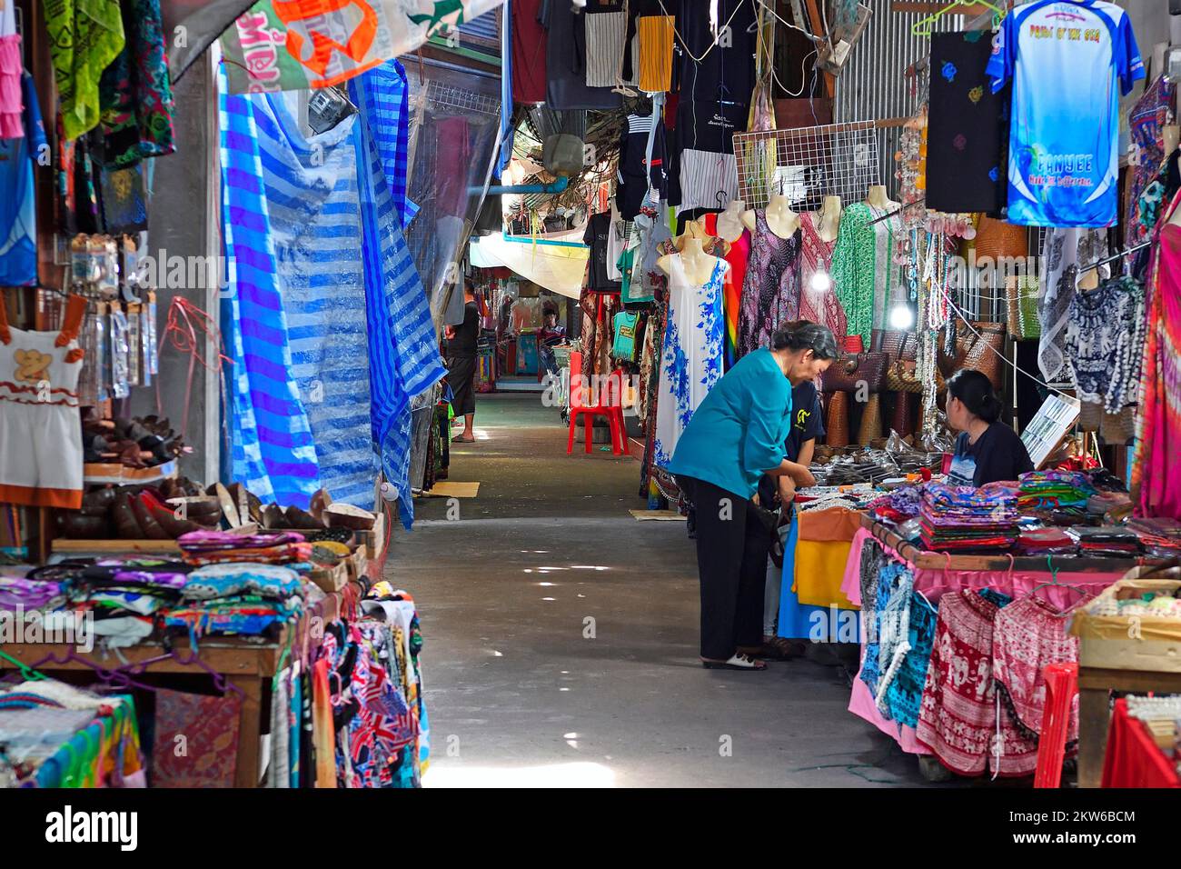 Stalls selling textiles and other items in the Muslim stilt village of ...