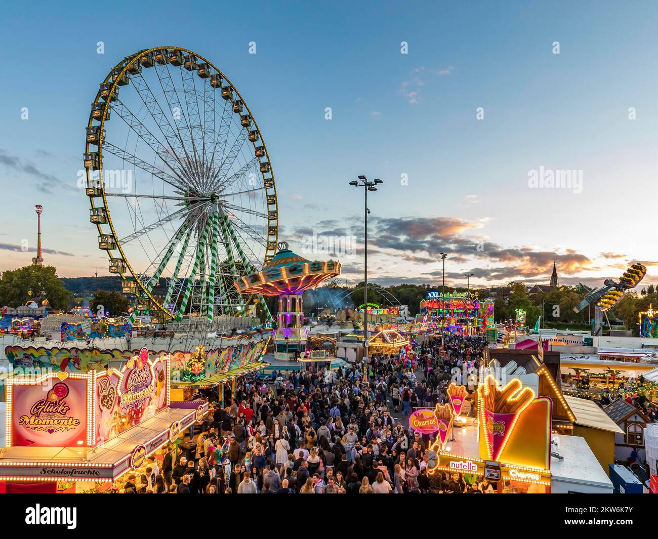 Ferris wheel, chain carousel and other rides and stalls at the ...