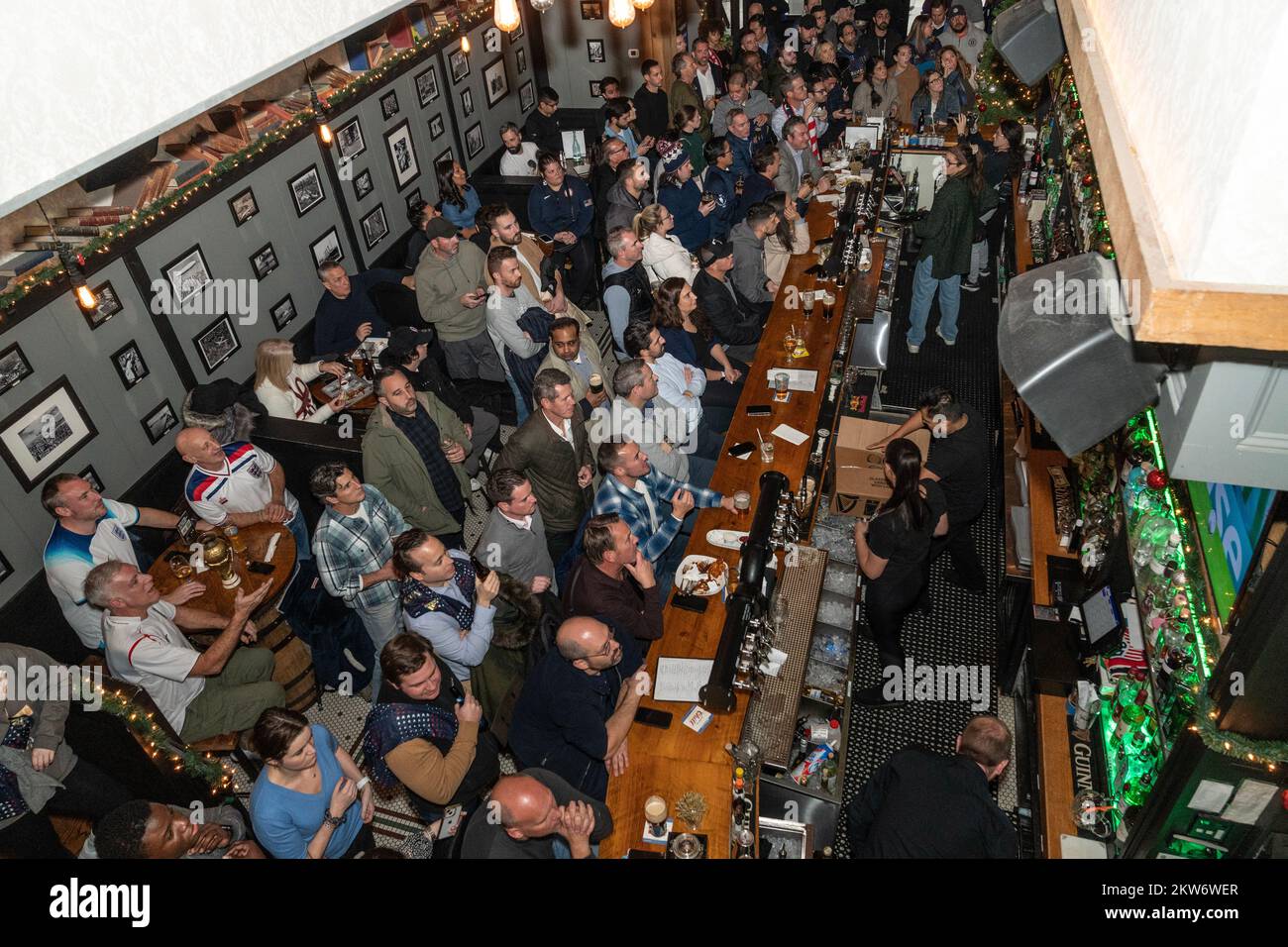 Fans of USA football team are watching the game against Iran at Qatar ...