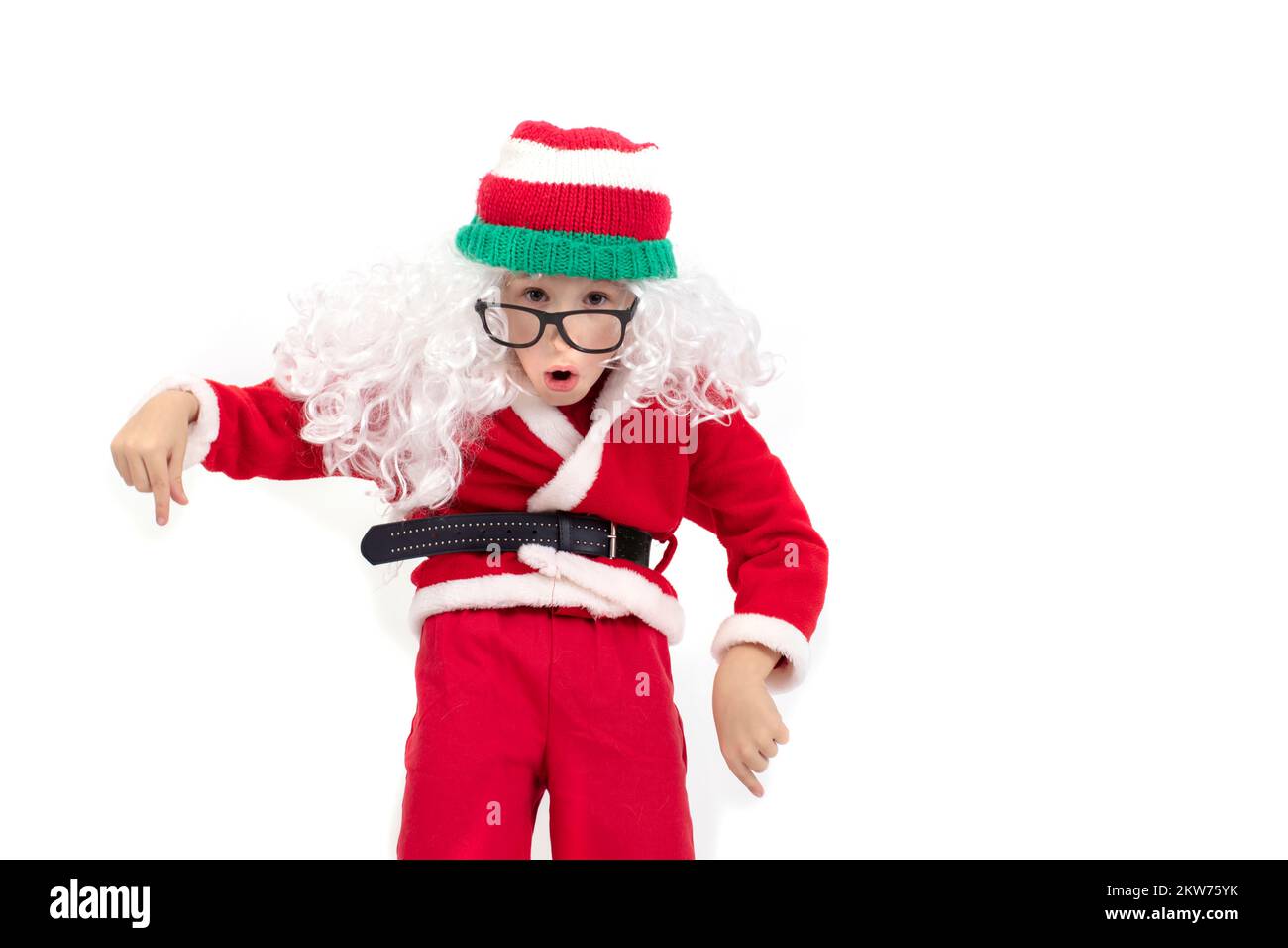 Funny child dressed as Santa Claus grimaces, poses, sings rap.Christmas ...