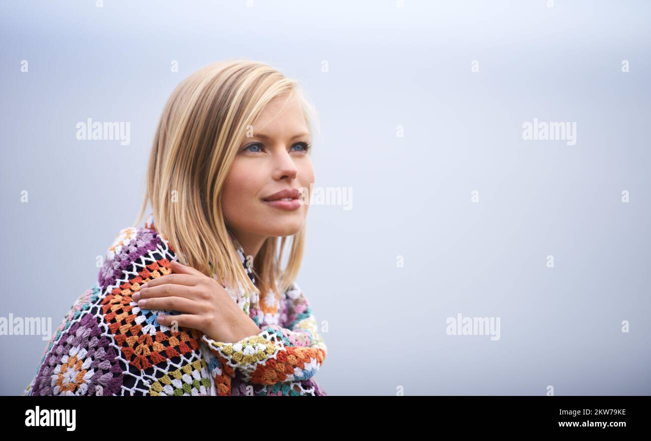 Morning contemplation. a beautiful young woman standing at the ocean ...