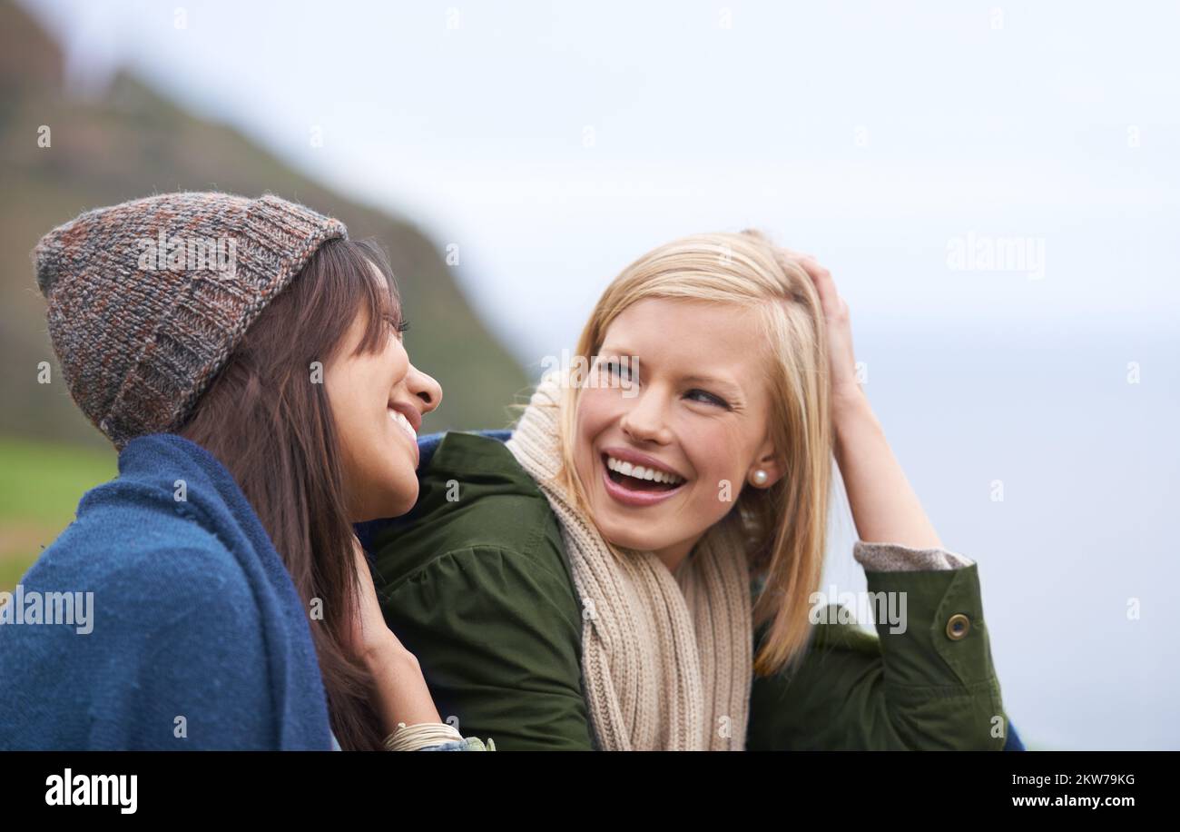 Beloved moments with my best friend. Two young women sitting together ...