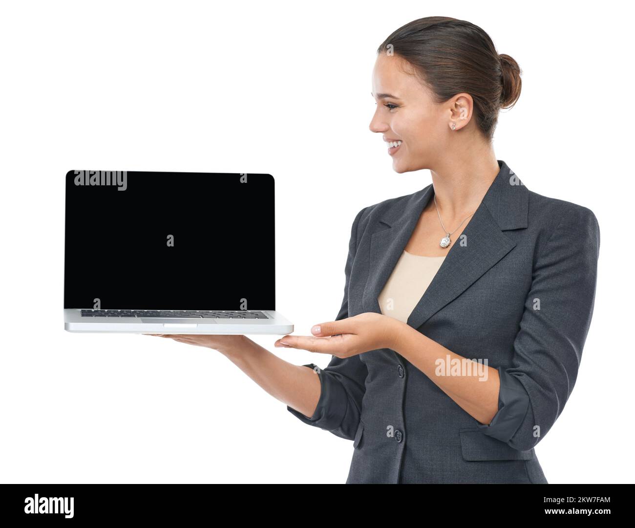 Allow me to present...A young woman gesturing towards a laptop against ...