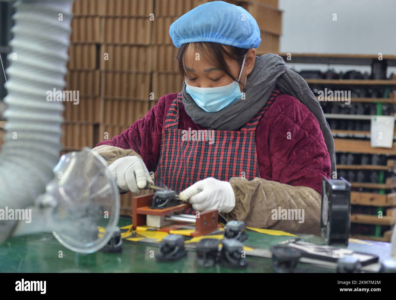 FUYANG, CHINA - NOVEMBER 30, 2022 - Workers assemble loudspeakers at a ...