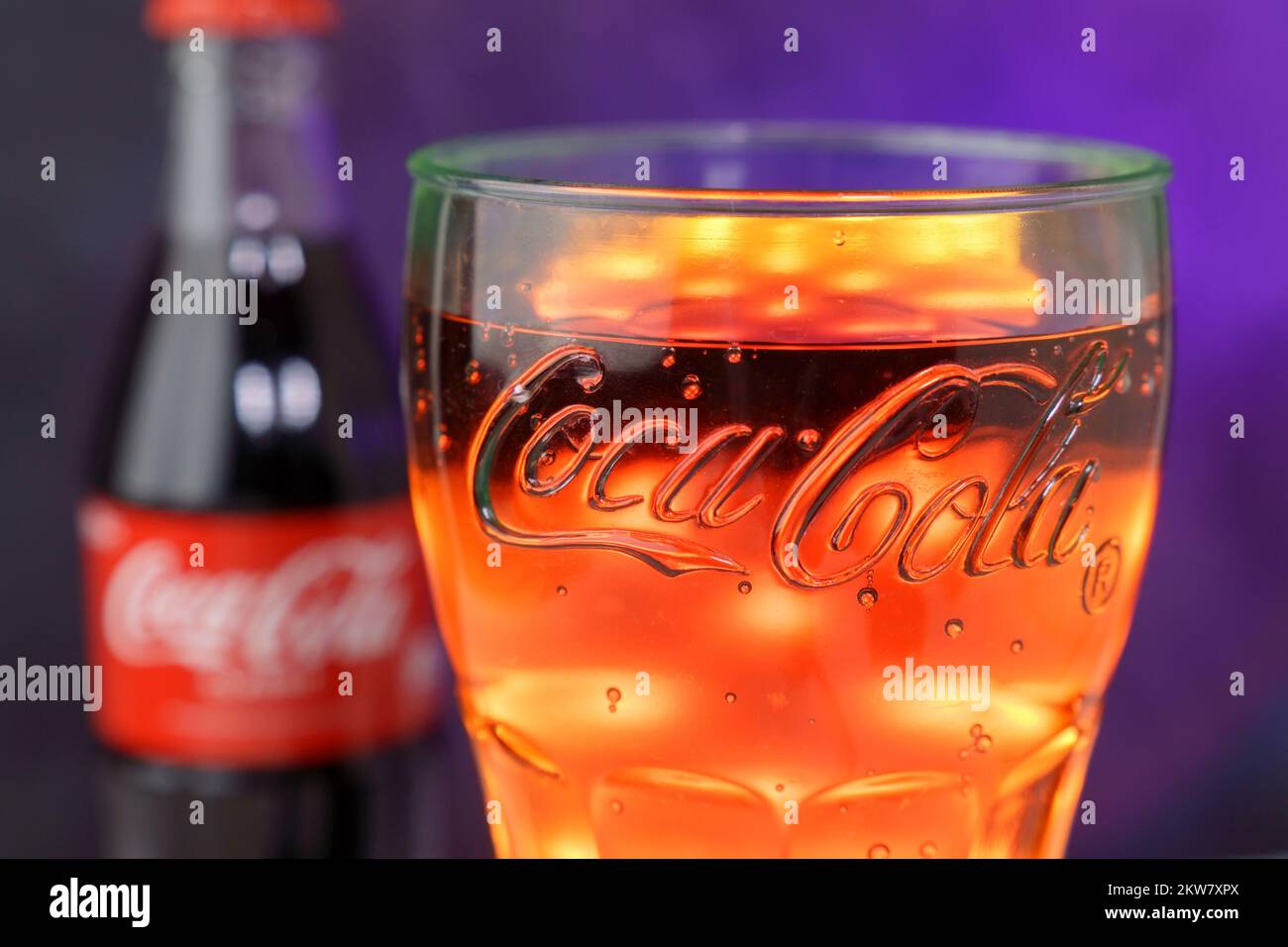 Tyumen, Russia-November 02, 2022: Coca Cola logo in a glass close-up ... Tyumen, Russia-November 02, 2022: Coca Cola logo in a glass close-up ...