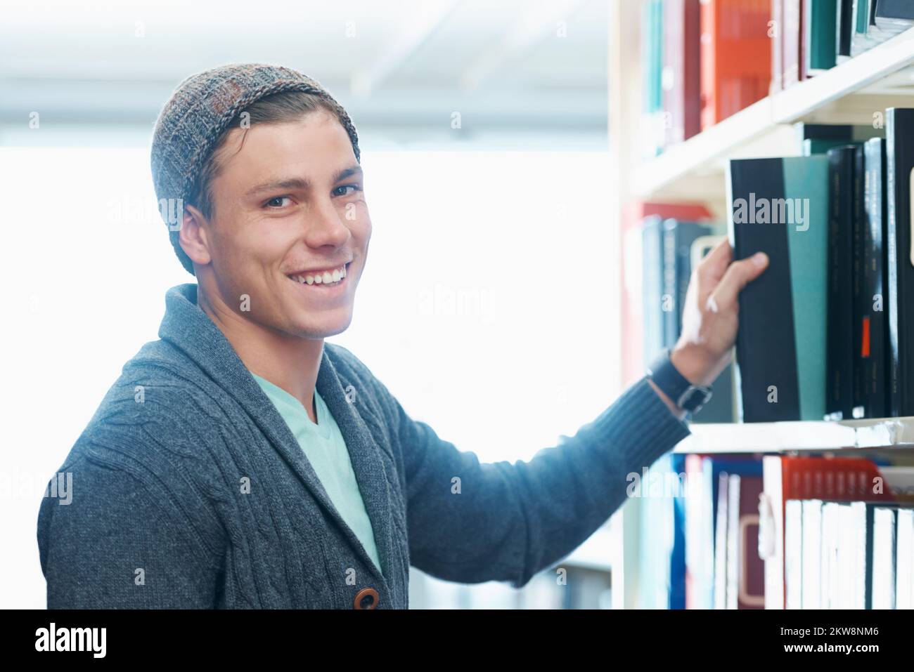 Getting his study material for the year. A young man standing and ...