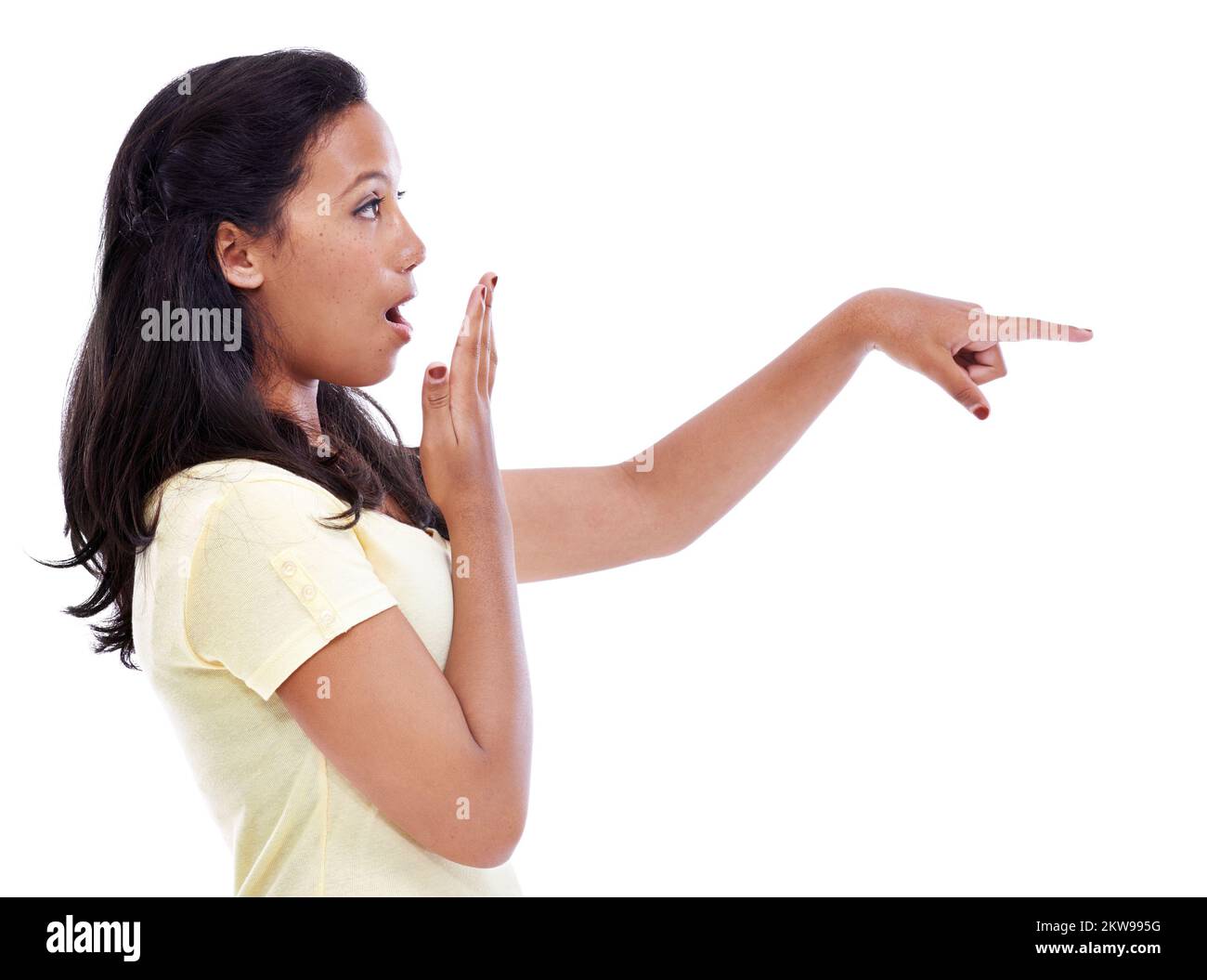 Look at that. A young woman pointing at copyspace while gasping Stock ...