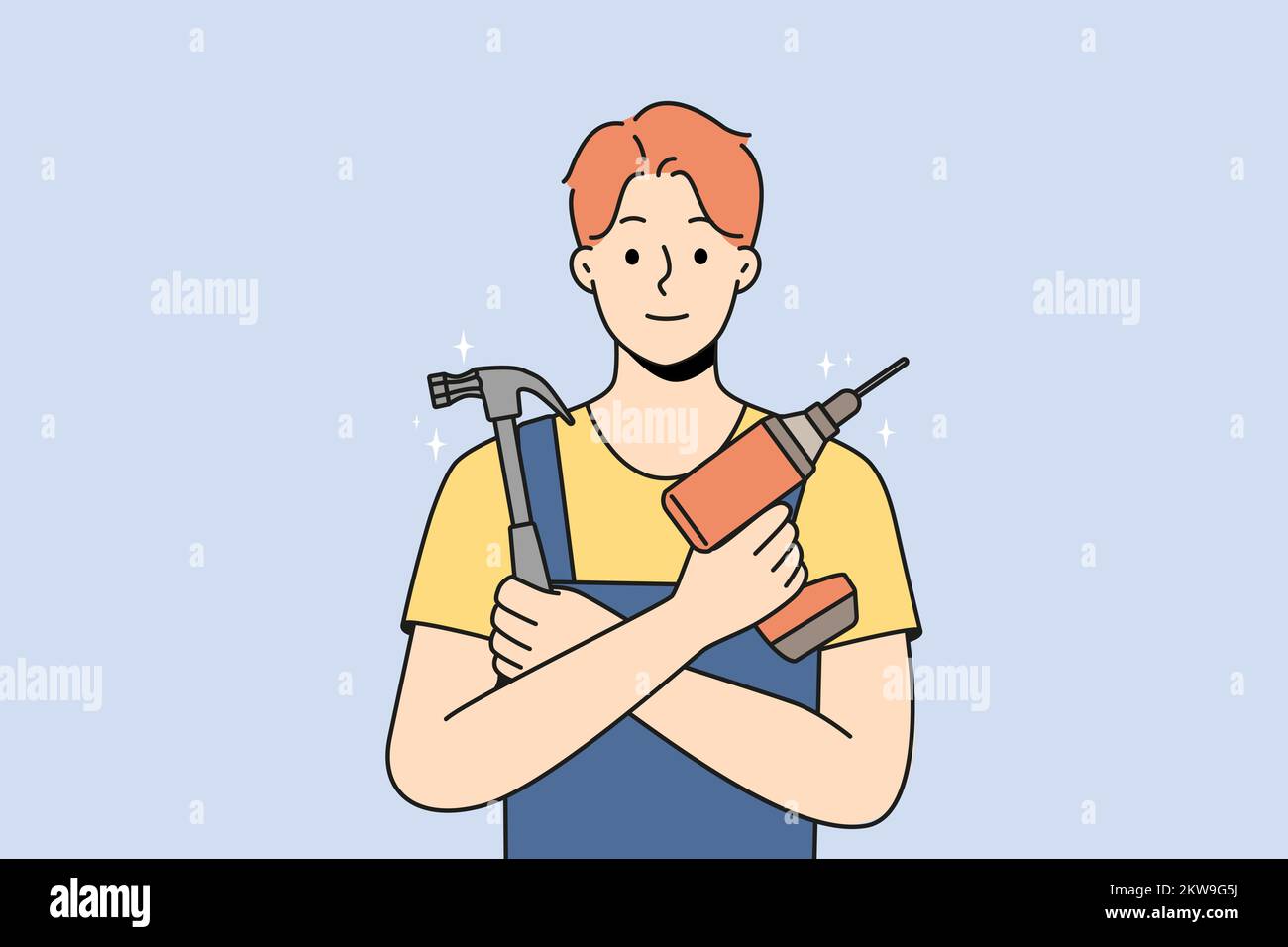Smiling young male mechanic in uniform holding repairing tools in hands ...