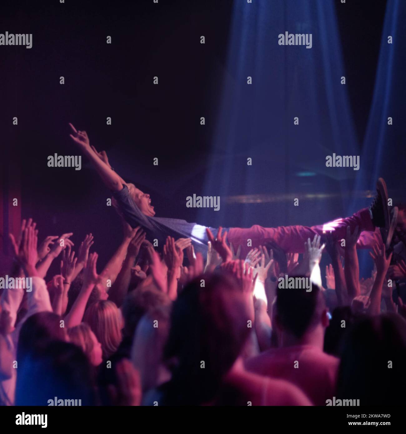 Carried by an amazing crowd. A stage diver being carried across the ...