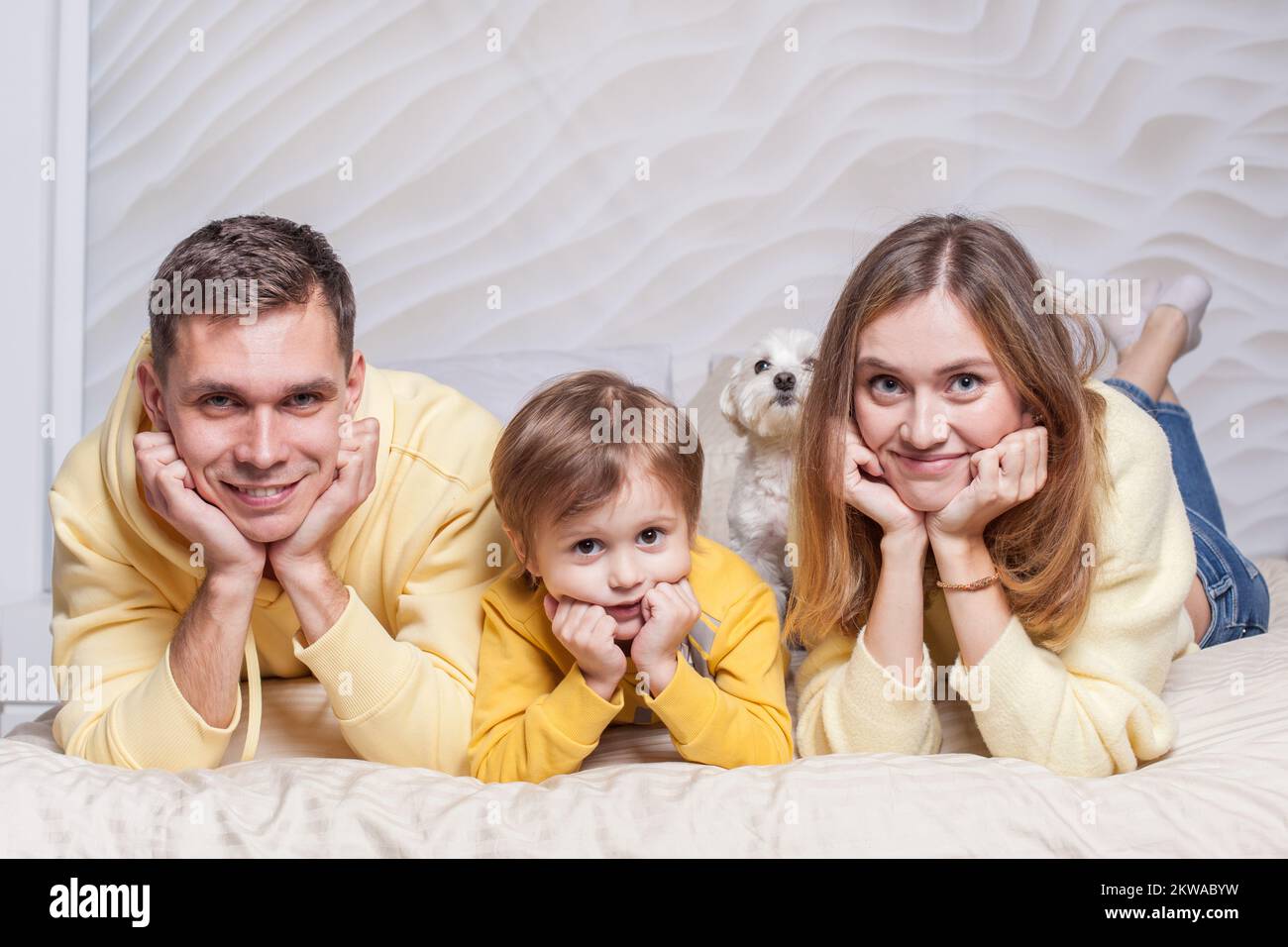 Portrait of lovely family, friendly parents, mom and dad with adorable ...