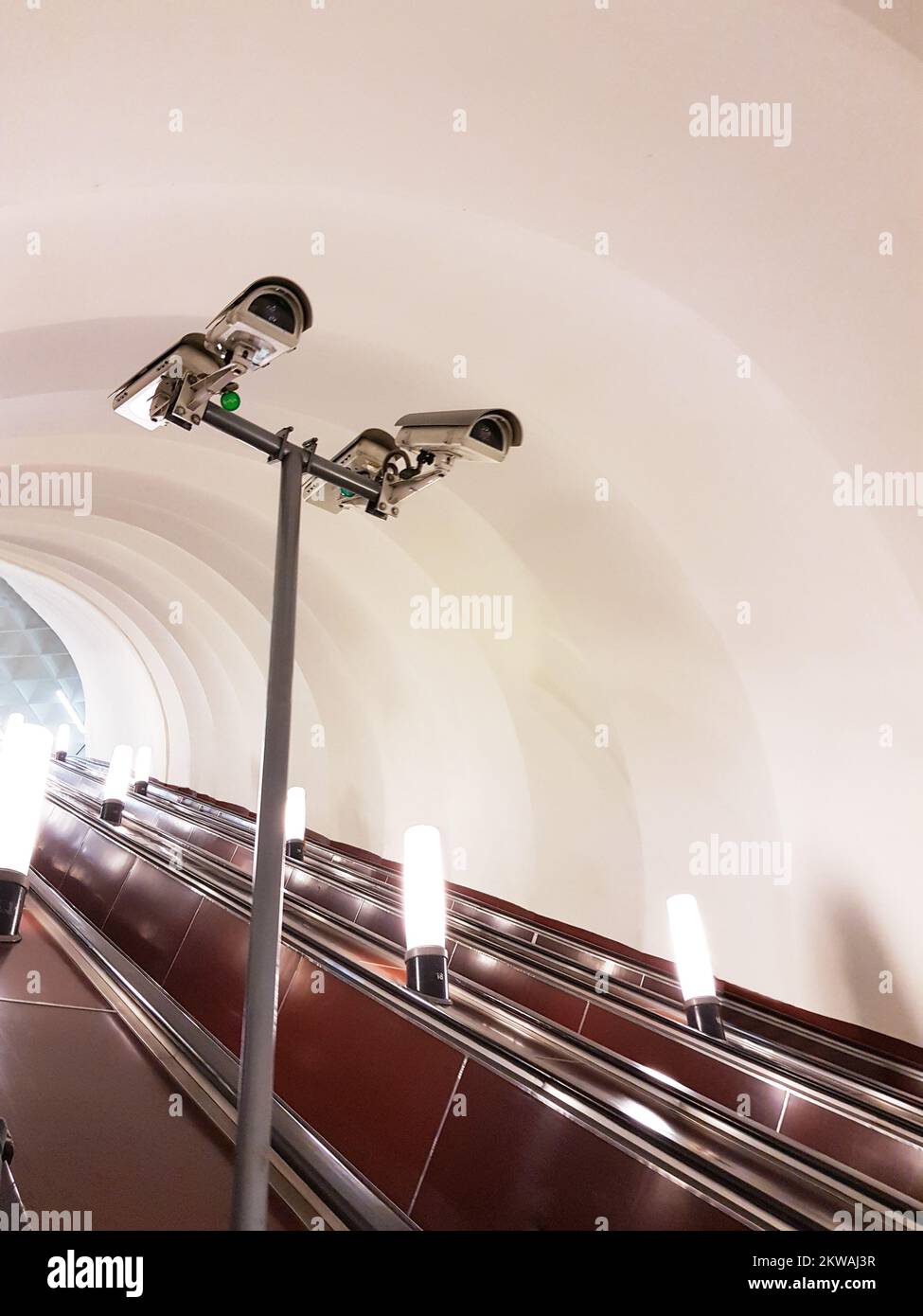 Four cameras underground on the subway station on escalator. Security ...