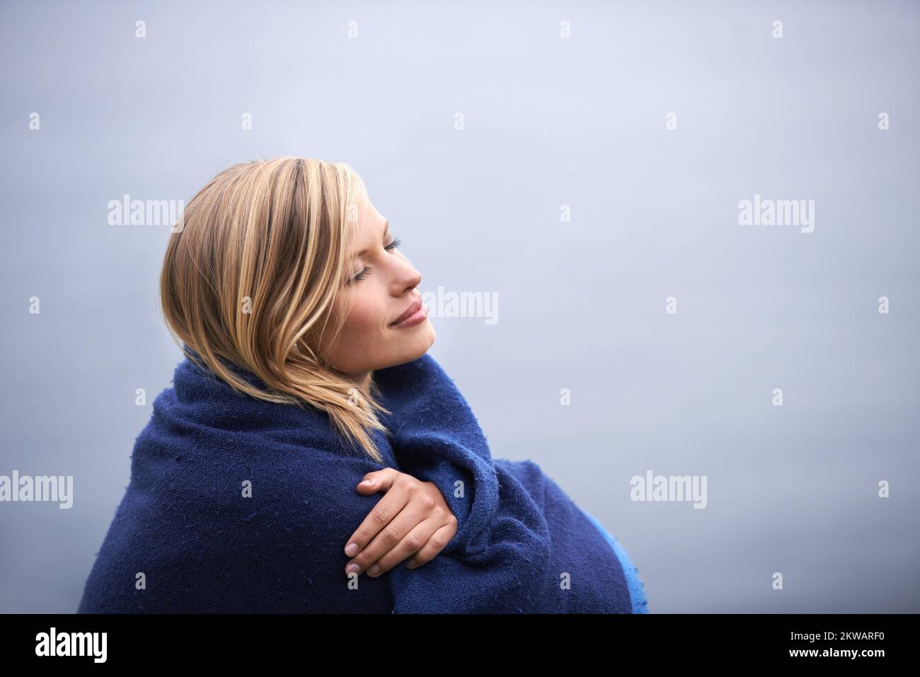 Morning contemplation. a beautiful young woman standing at the ocean ...