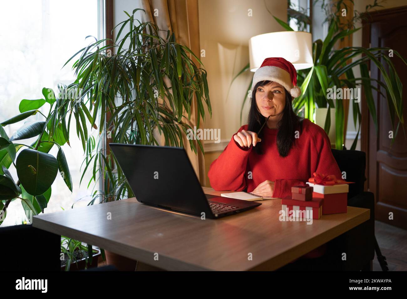 Waiting for inspiration. Thoughtful young woman holding pencil in hand ...