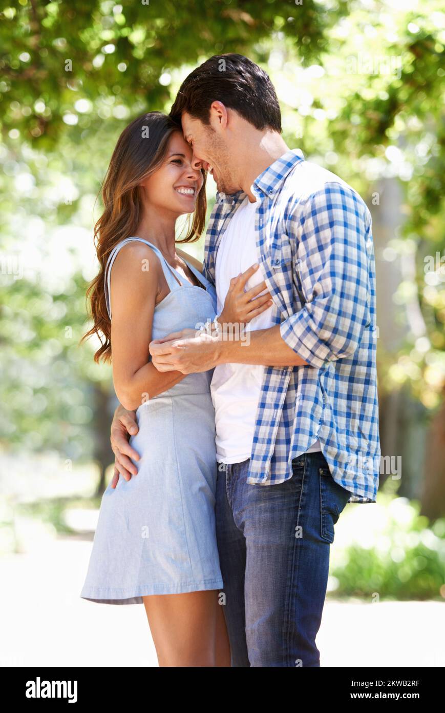 Romantic moments. A loving young couple standing in the summer sun ...