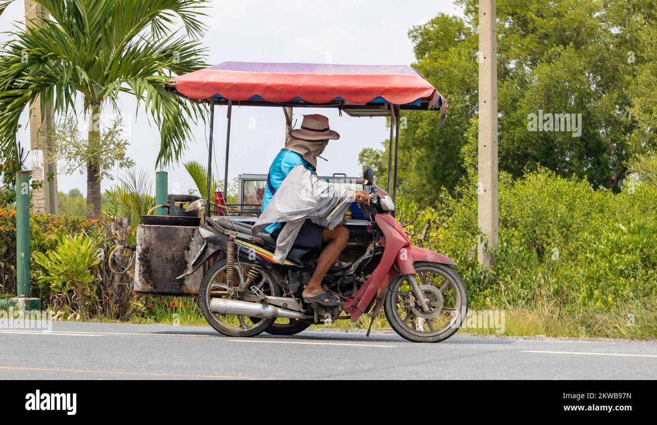 A food seller drives a sidecar on the tropical road, Thailand Stock ...