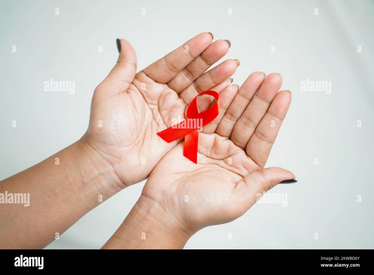 Worlds HIV Aids Day 2022-2023, Closeup hands holding red aids awareness ...