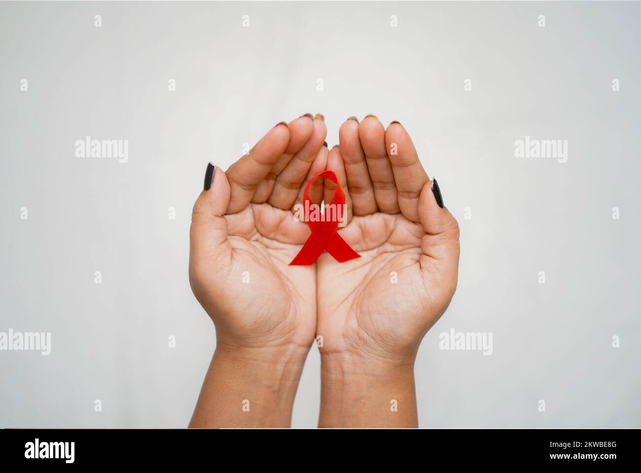 Worlds HIV Aids Day, A top view Closeup hands holding red aids ...