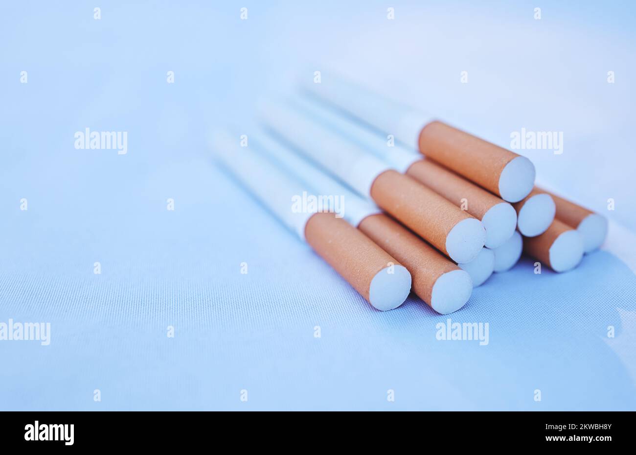 Cigarette, cancer and smoke with a tobacco product on the ground ...