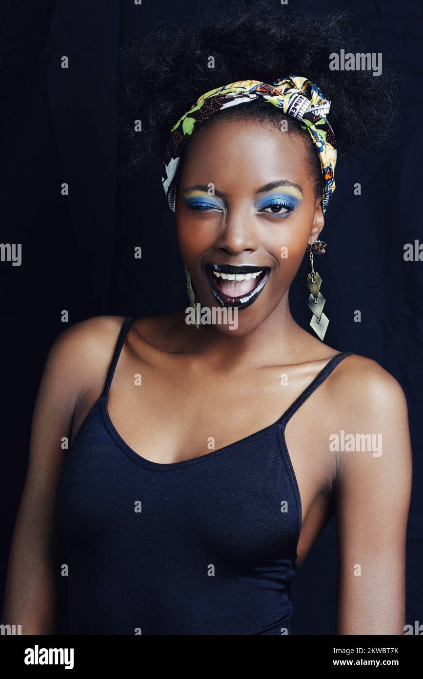 Shes a true african beauty. A beautiful african woman posing against a ...