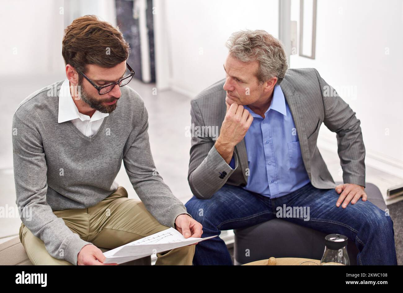 Sharing project ideas. a group of young professionals discussing ...