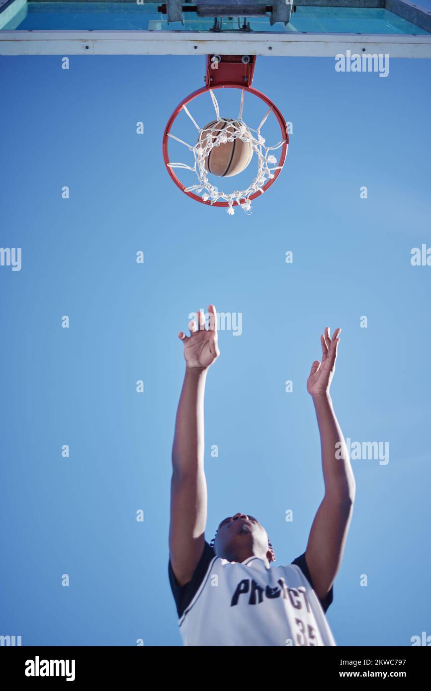 Basketball jump, goal and man on court playing a game low angle for ...