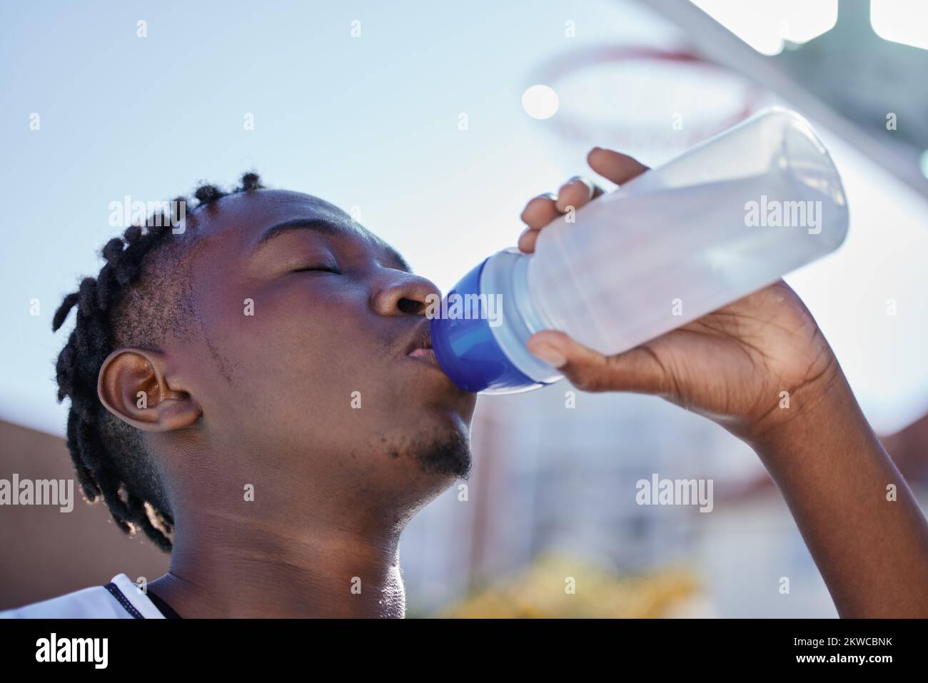 Water, hydration and healthy lifestyle of a sporty black man drinking ...