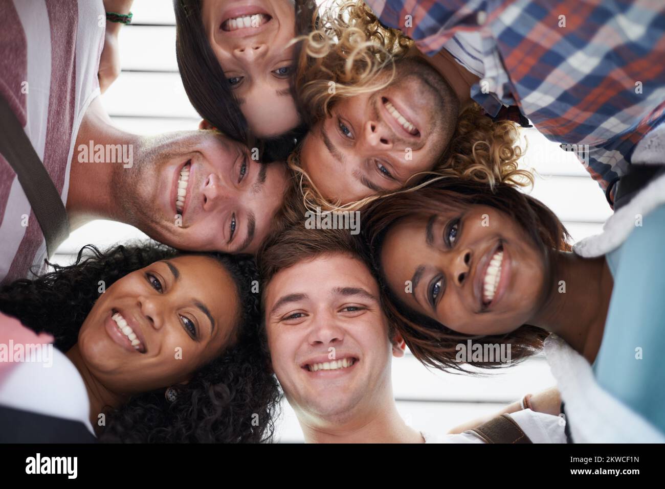 Enjoying campus life. Low angle shot of young university students ...