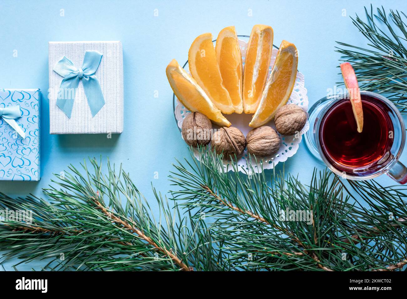 Hot mulled wine with orange, anise, cardamon and cinnamon on blue ...