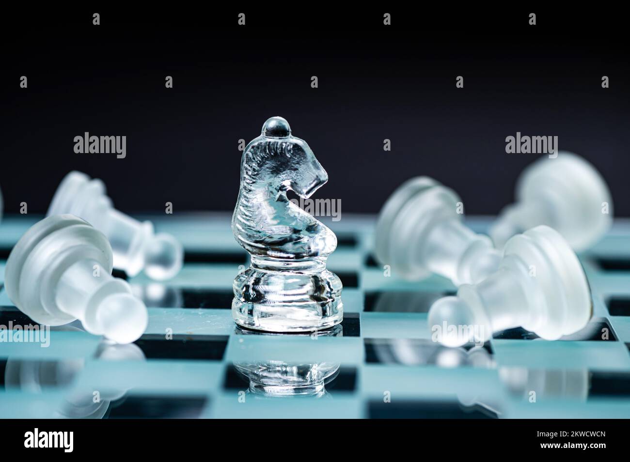 glass chess board game in black background ,selective focus on King ...