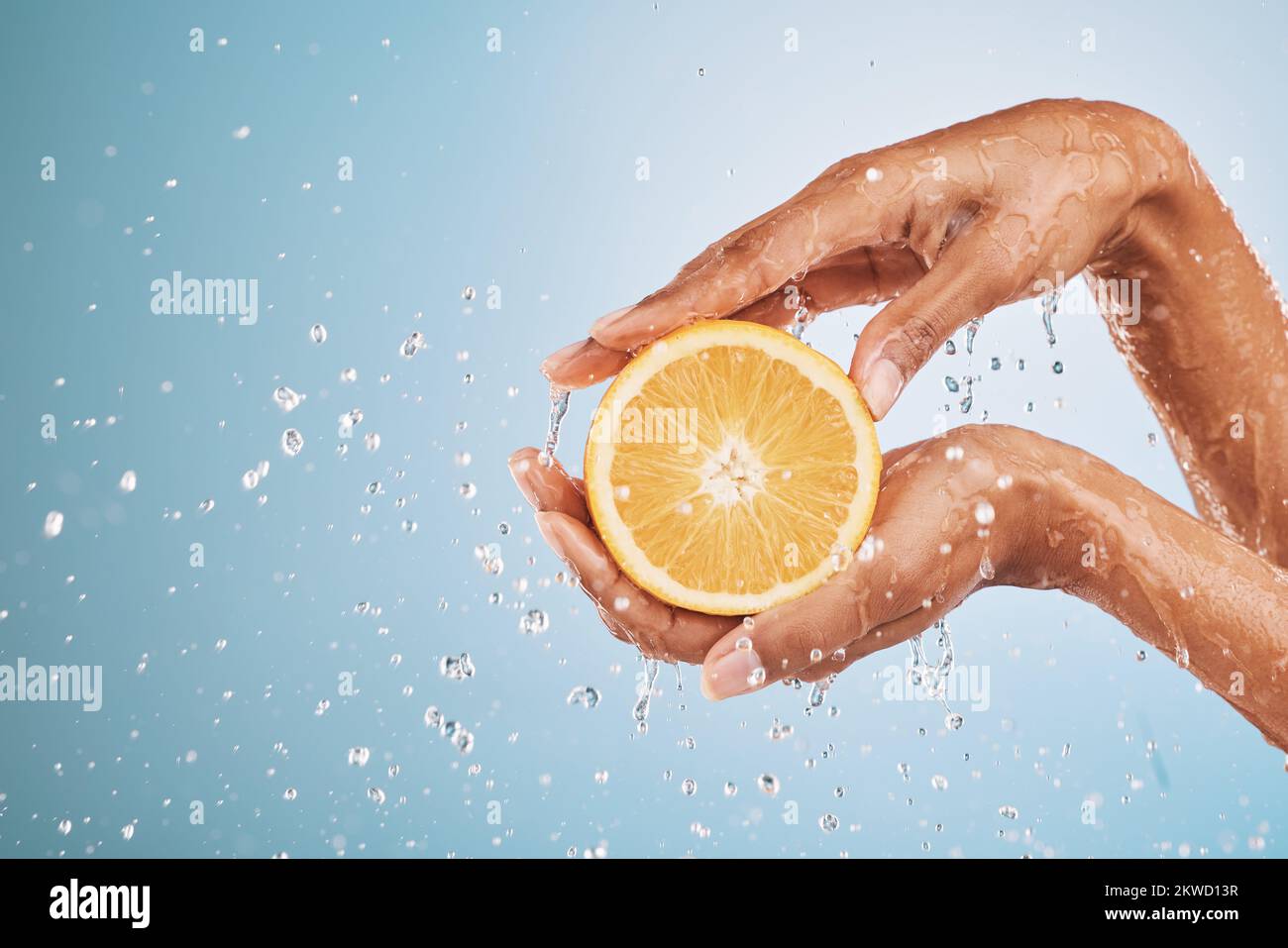 Orange, woman hands and water splash for beauty, vitamin c detox and ...