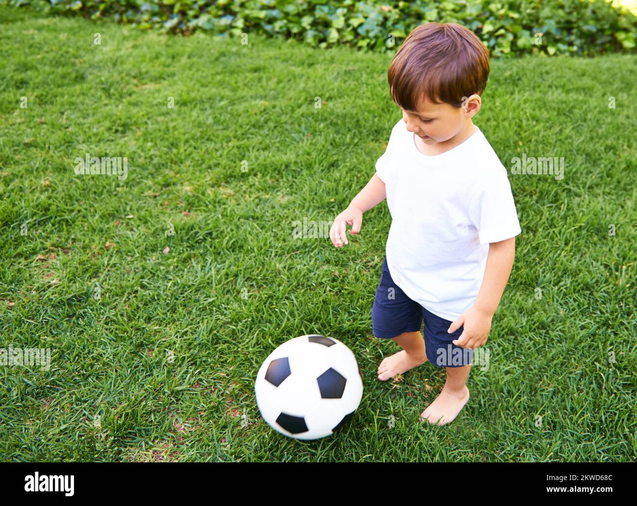 True players learn the game step by step. an adorable little boy ...