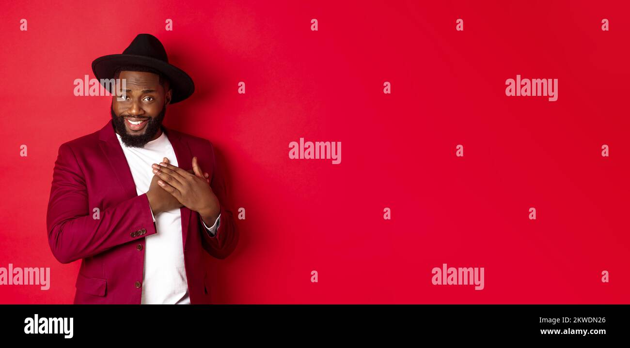 Fashion and party concept. Handsome african american macho man flirting ...