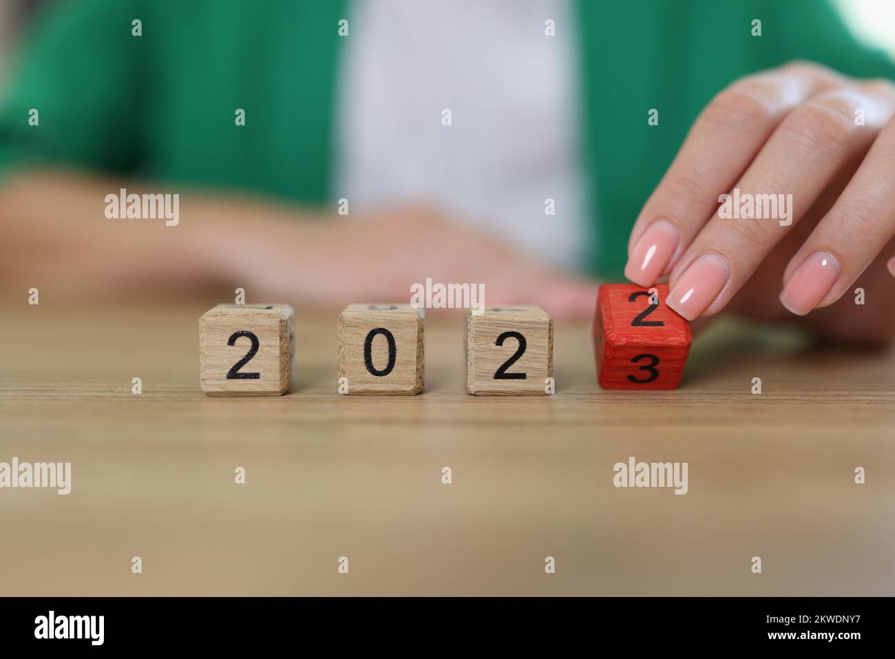Close up of flipping of wooden cube block change from 2022 to 2023 ...
