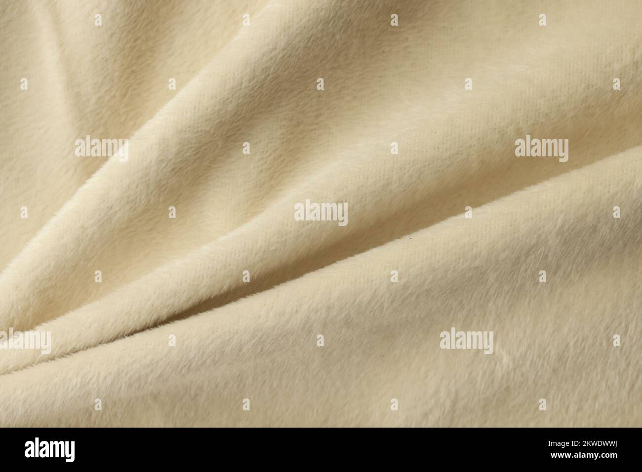 Soft wavy beige blanket as background Stock Photo - Alamy