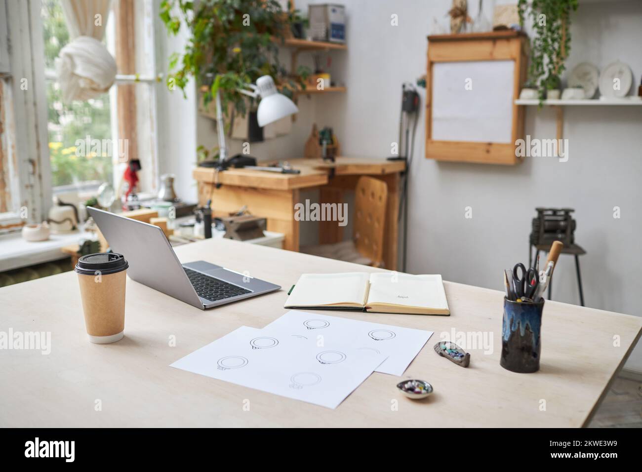 Background image of workplace with designs and computer in workshop ...