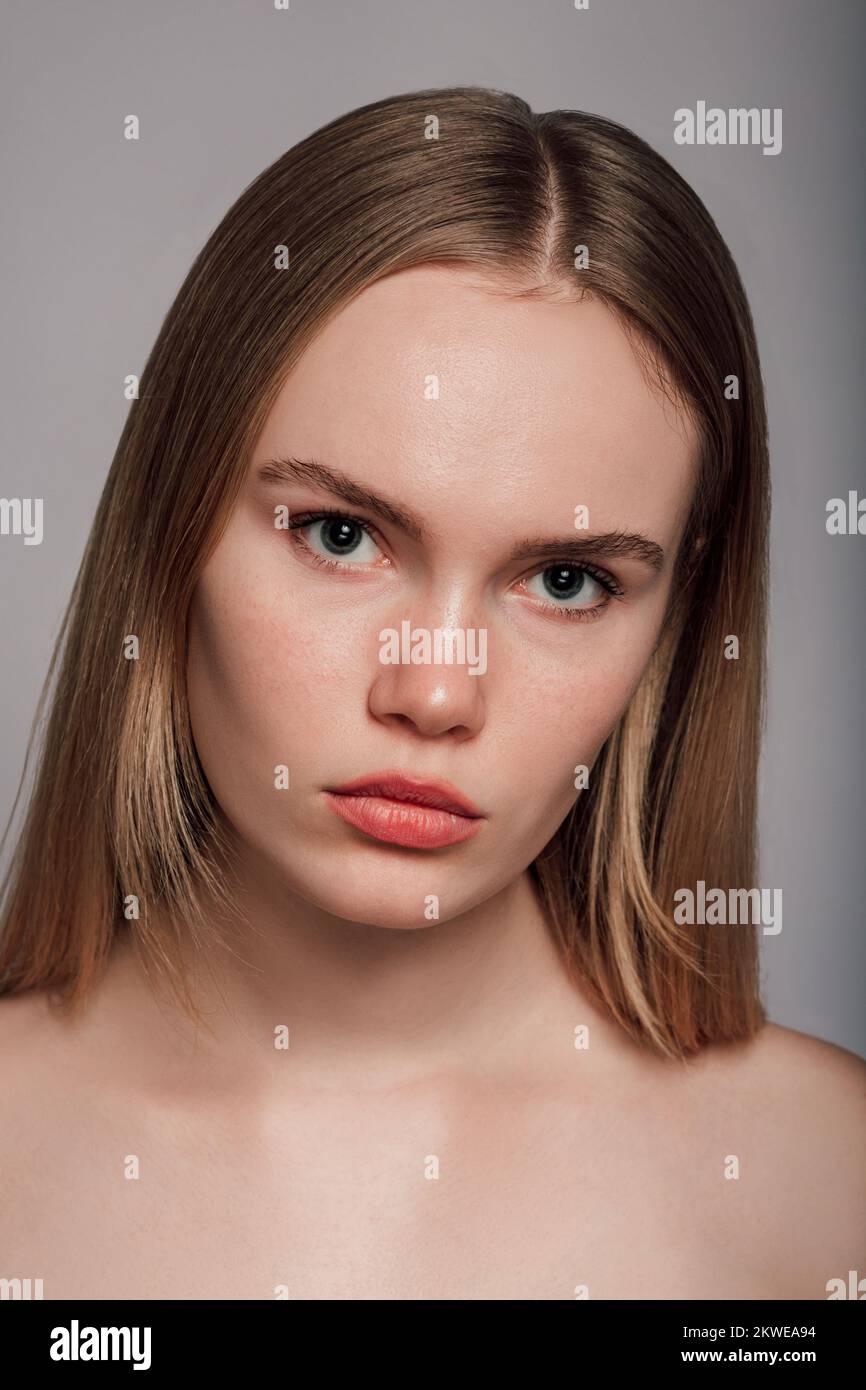 Portrait of a young beautiful serious woman. Sad Girl Stock Photo - Alamy