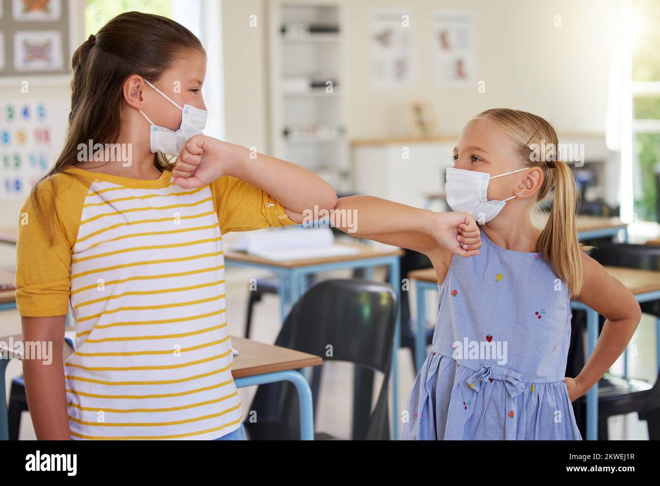 Student bumping elbows hi-res stock photography and images - Alamy