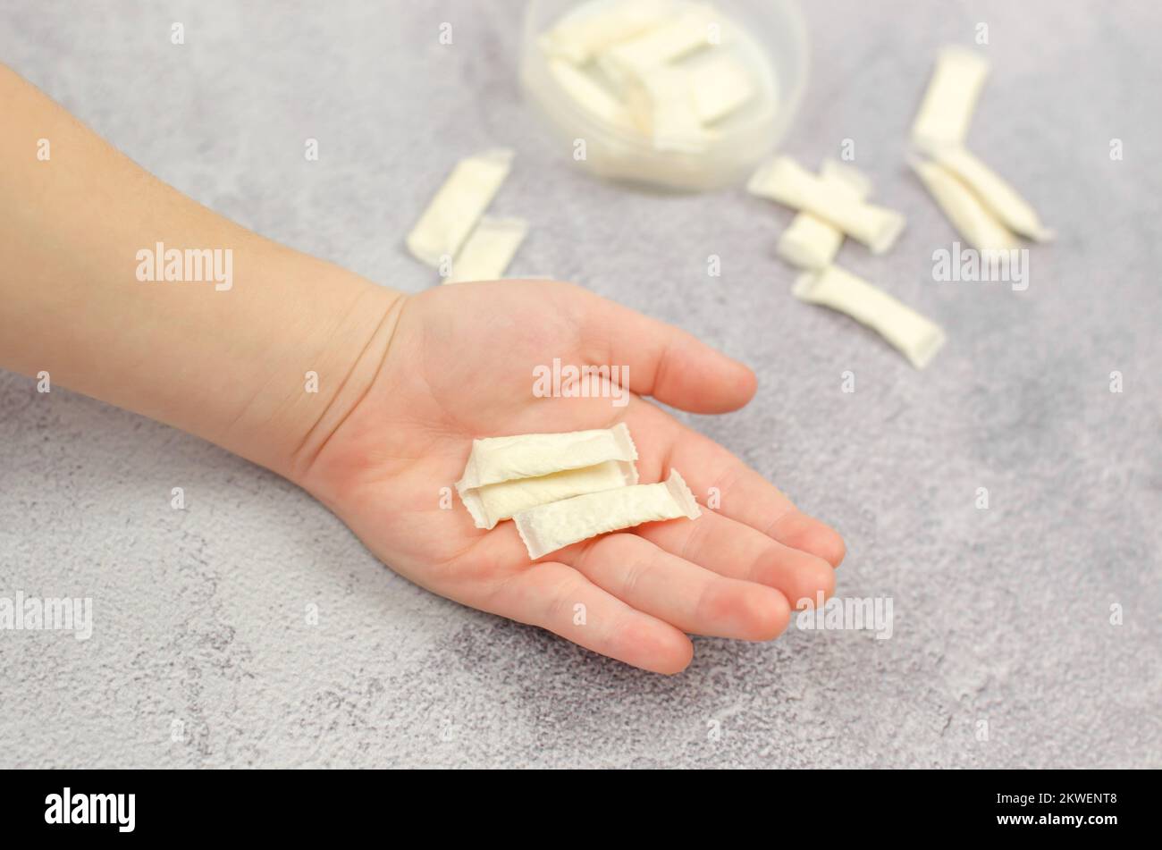 Swedish snus in a child's hand. Child drug addiction concept Stock ...