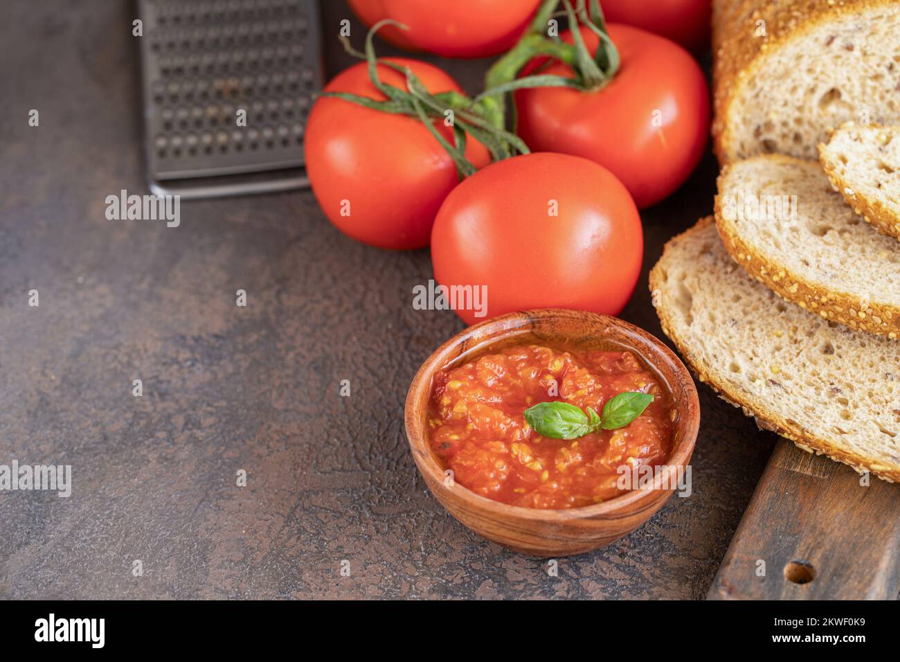 Top view of popular Spanish tapa, Crusty bread with fresh tomato or pan ...