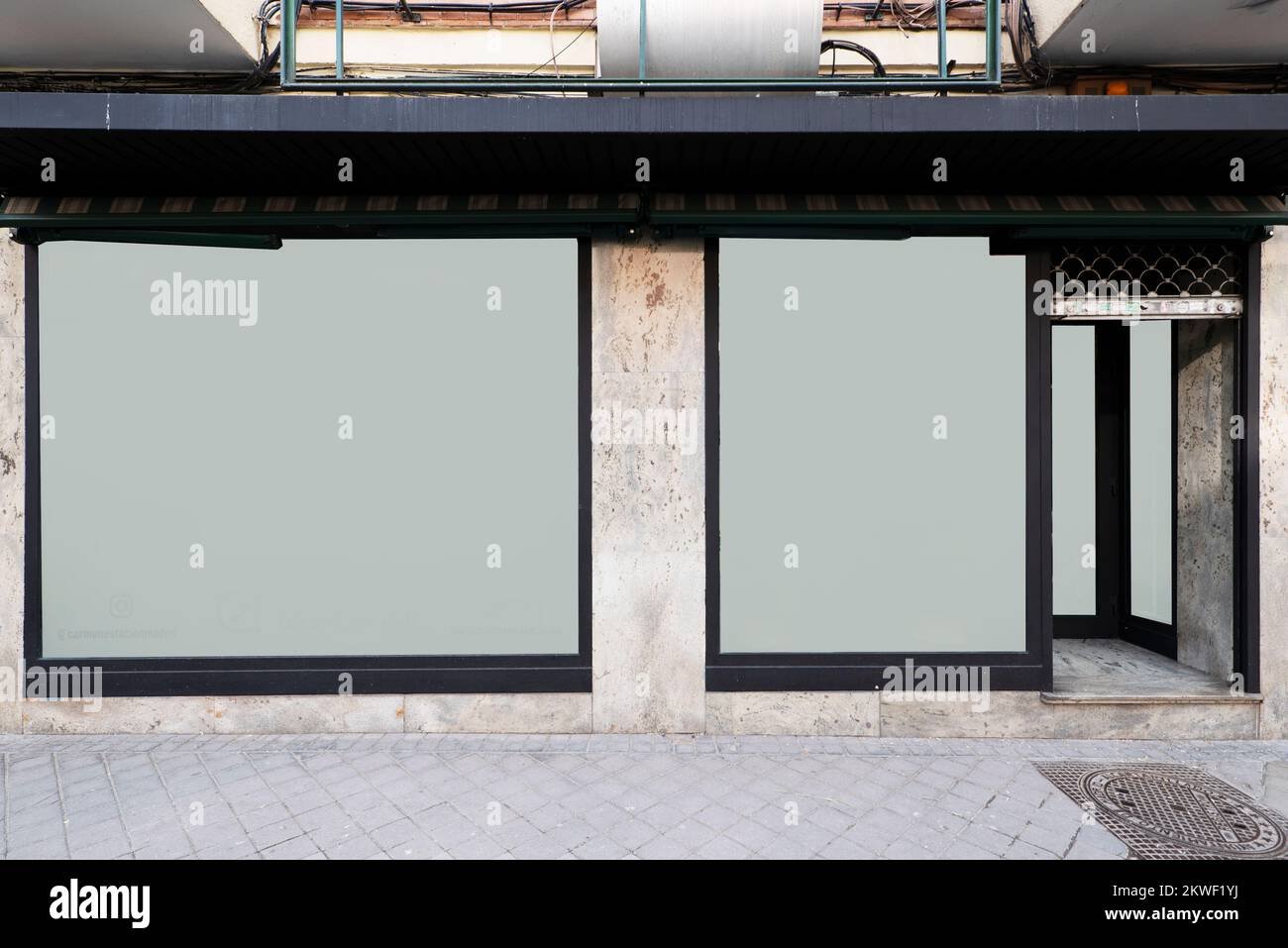 Front of a commercial premises to the front with white glass windows ...