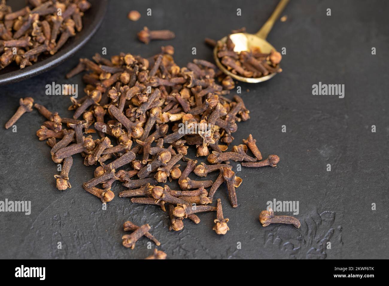 Natural clove spice on dark concrete background Stock Photo - Alamy