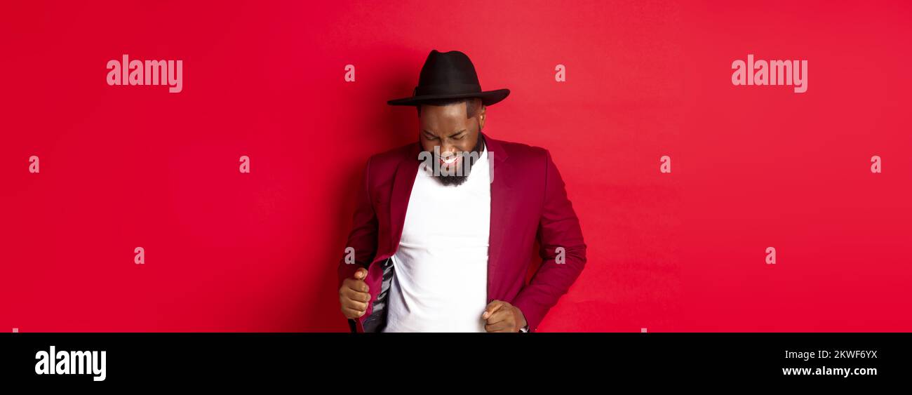 Christmas and people concept. Happy Black man celebrating New Year and ...