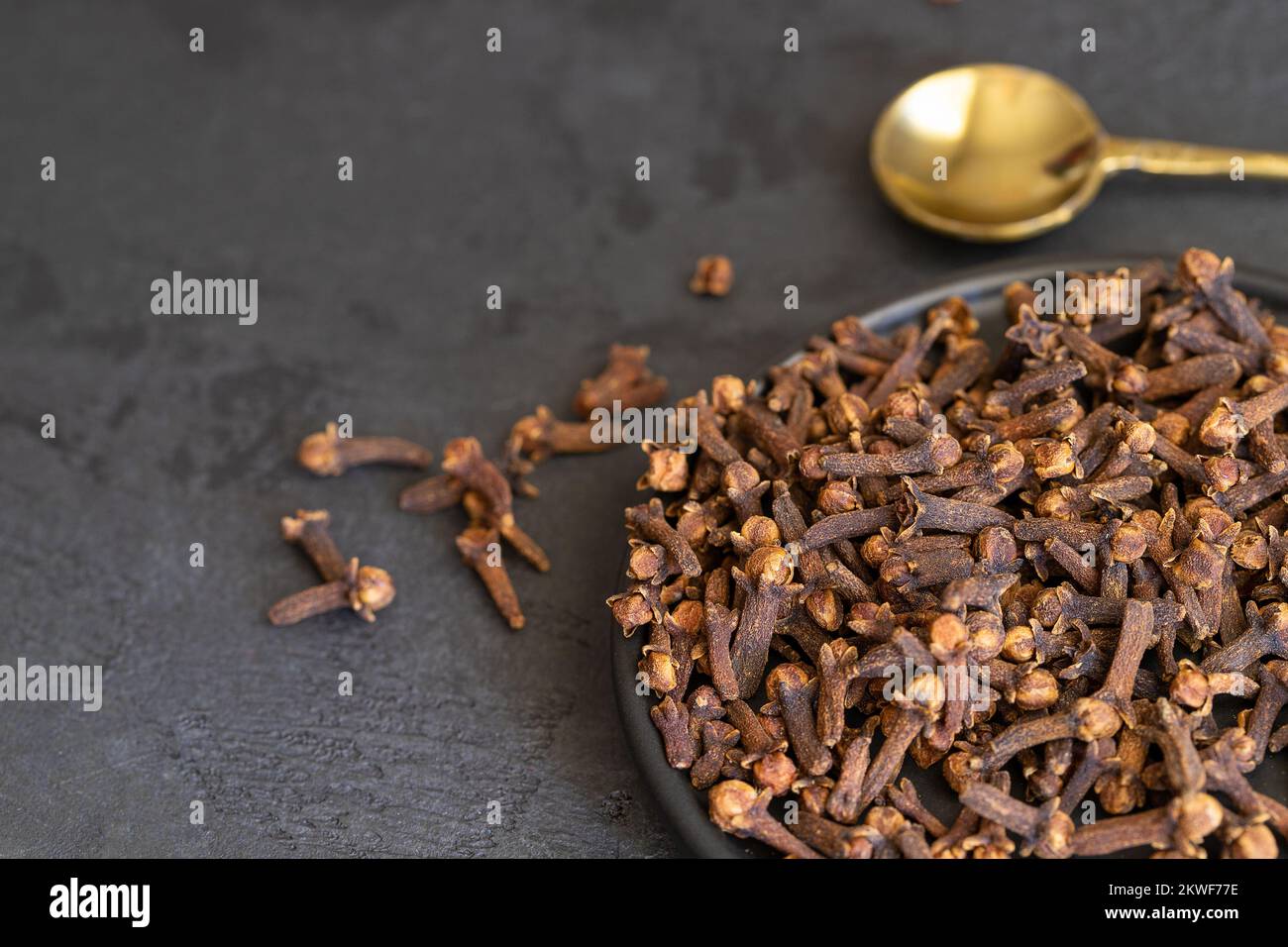 Natural clove spice on dark concrete background Stock Photo - Alamy