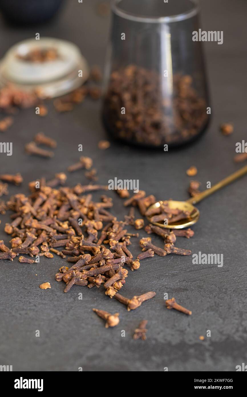 Natural clove spice on dark concrete background Stock Photo - Alamy