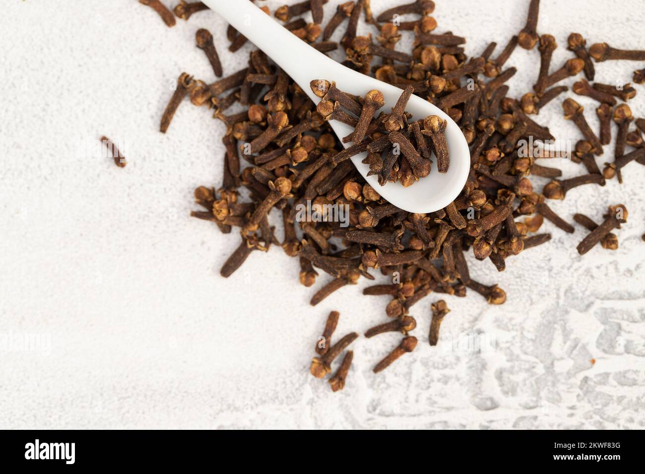 Natural clove spice on ehite concrete background with copy space Stock ...