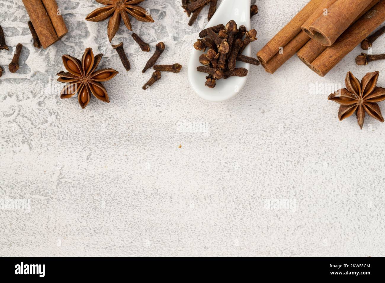 Different spices cinnamon, cloves, star anise on white background ...