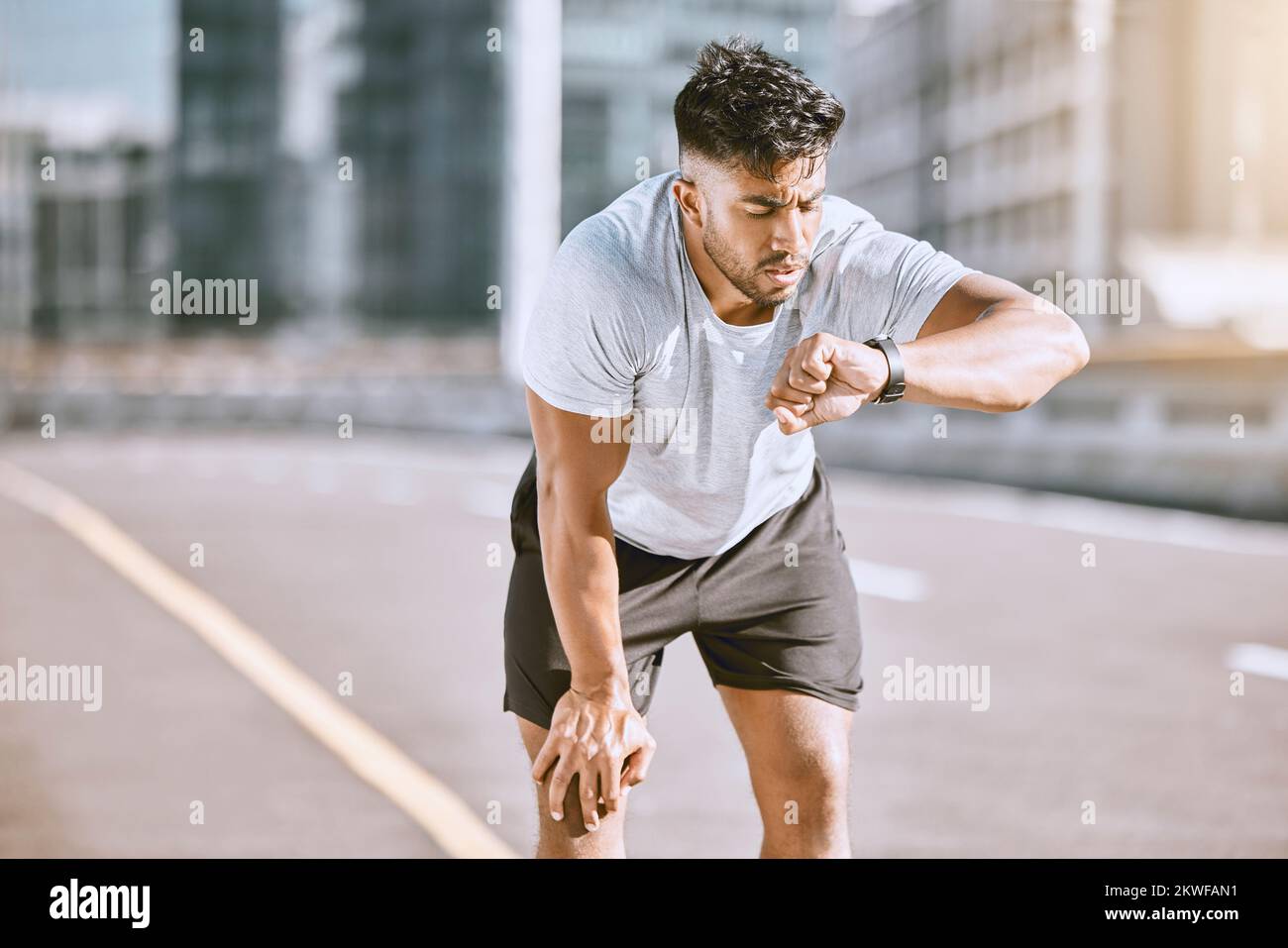 Fitness, tired and runner checking watch for running speed, pace and ...