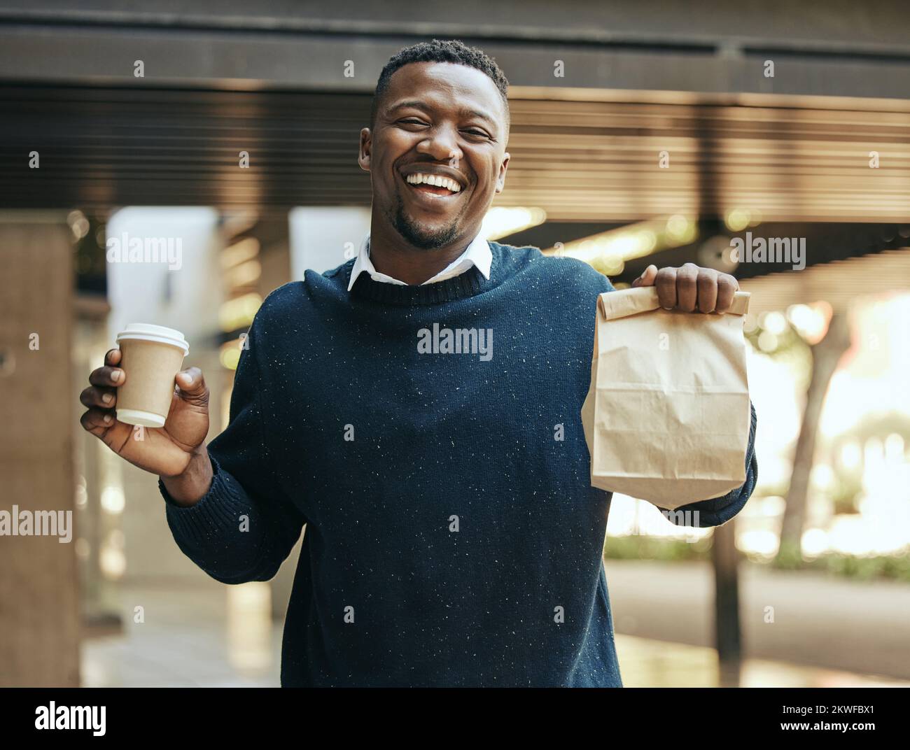 Business man with food and coffee in city, eating fast food during work ...