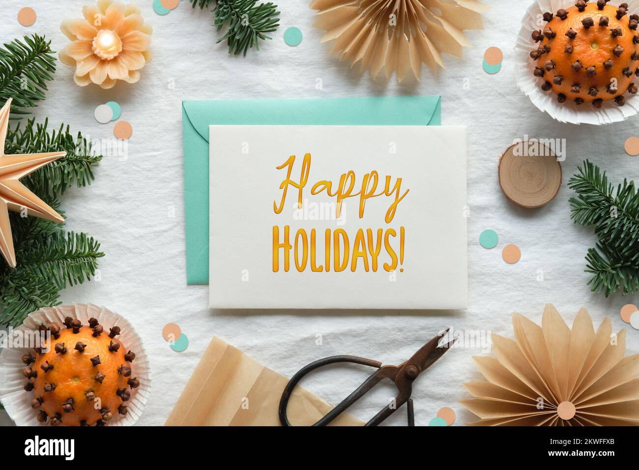 Fragrant pomander balls handmade from tangerines and cloves. Flat lay ...